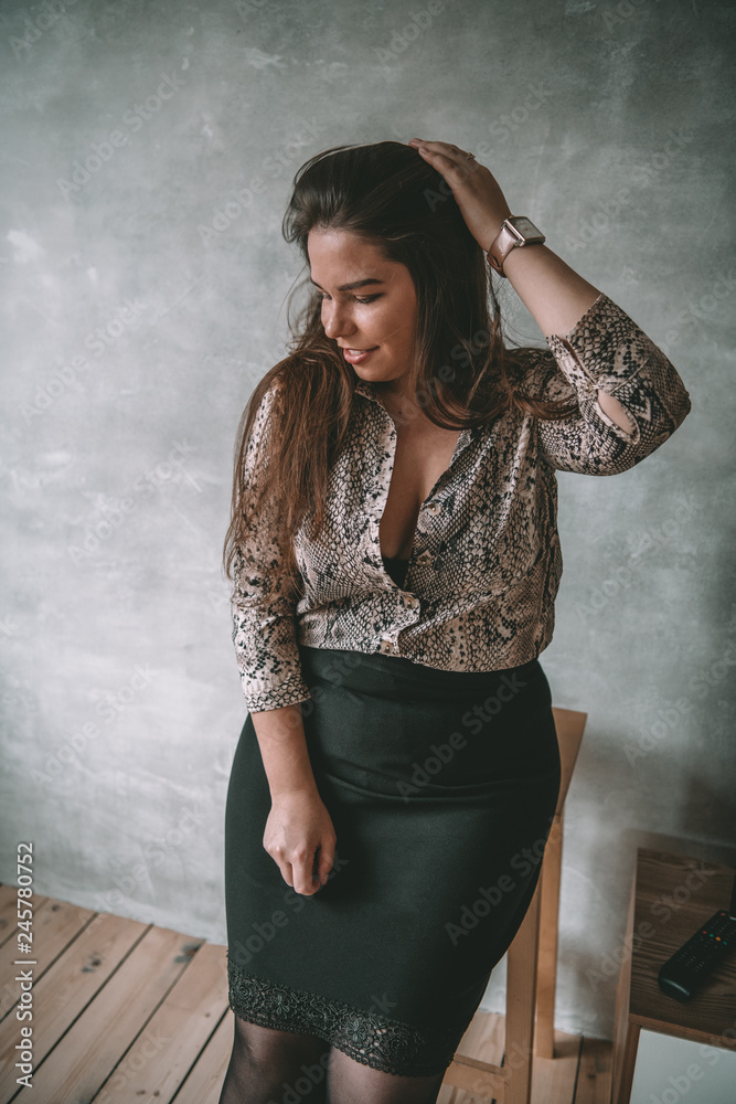 Plus size fashion model in casual clothes, woman on studio background ...