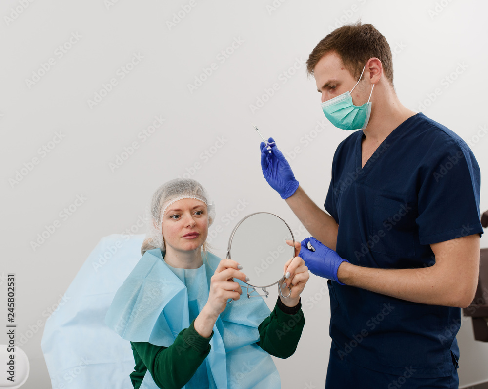 girl do plastic operation in medical clinic; doctor does lip ...