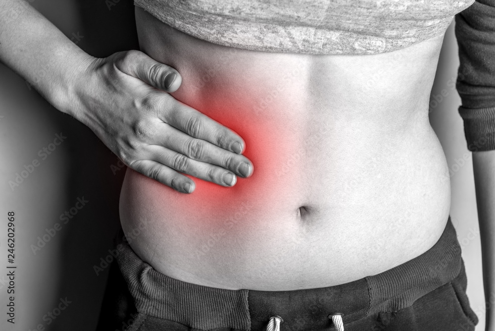 Hand holding the liver on black background. Pain in the abdomen ...