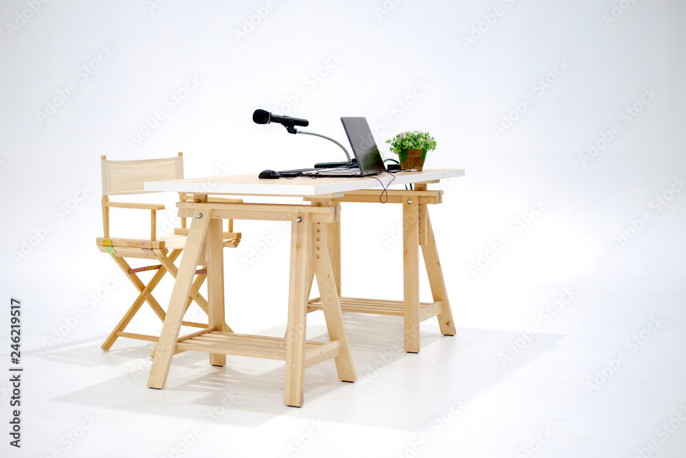 Studio wood table with laptop and microphone, small plant pot design ...
