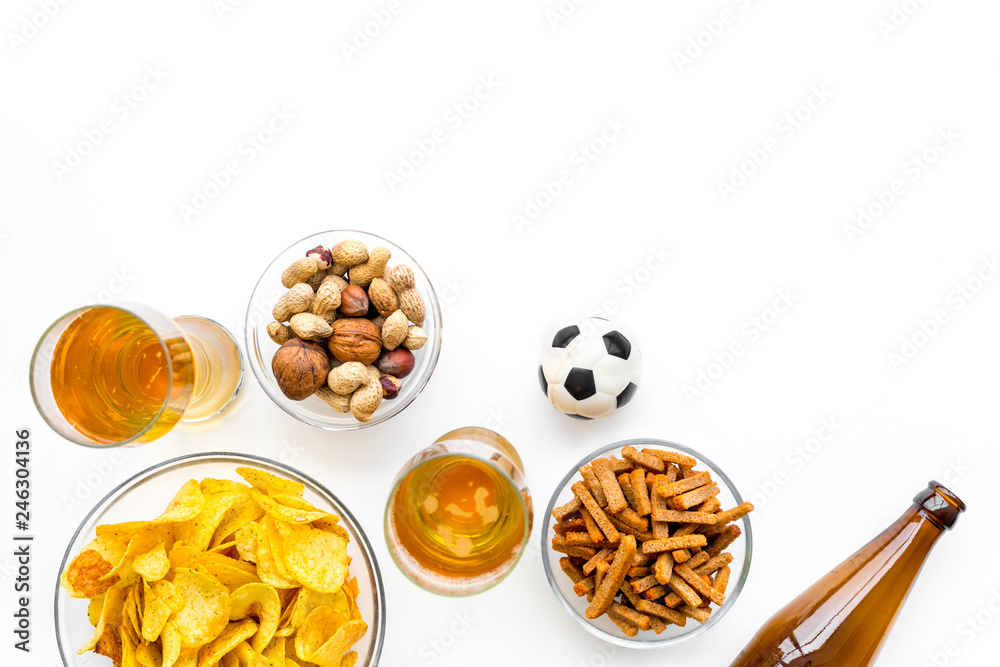 Snacks for watching football on TV. Watching sports. Chips, nuts, rusks ...