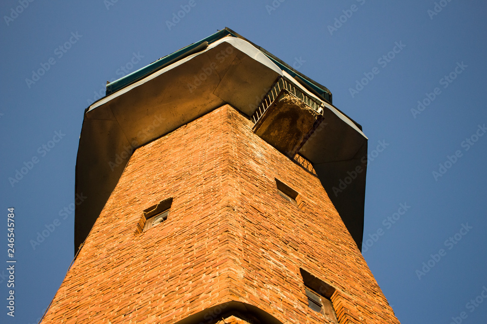 Old water tower. The brickwork of the past. Tower to fight fire. The ...
