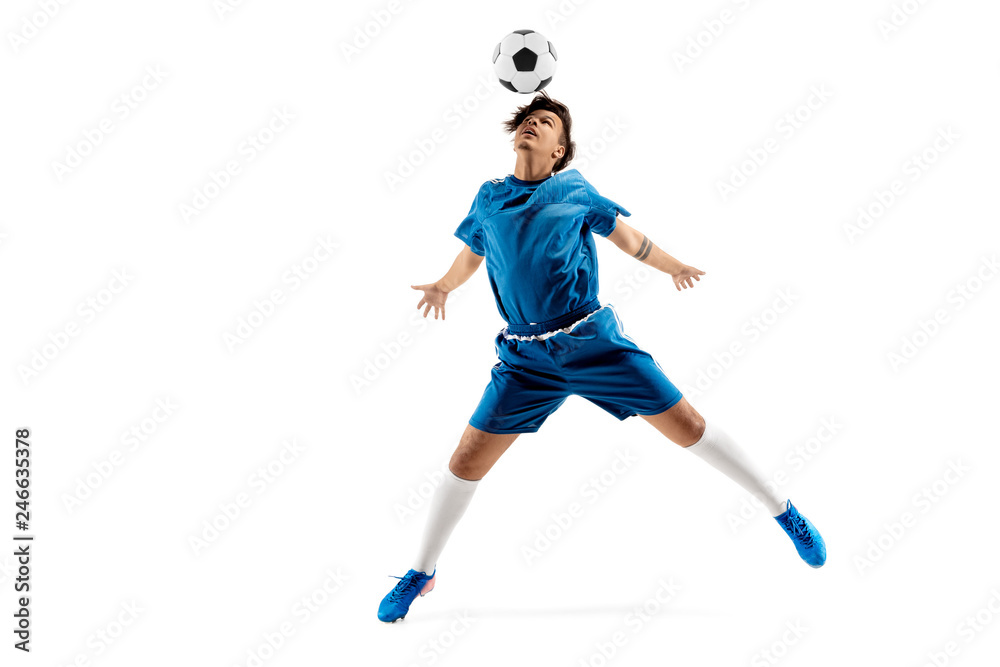 Young boy with soccer ball doing flying kick, isolated on white ...