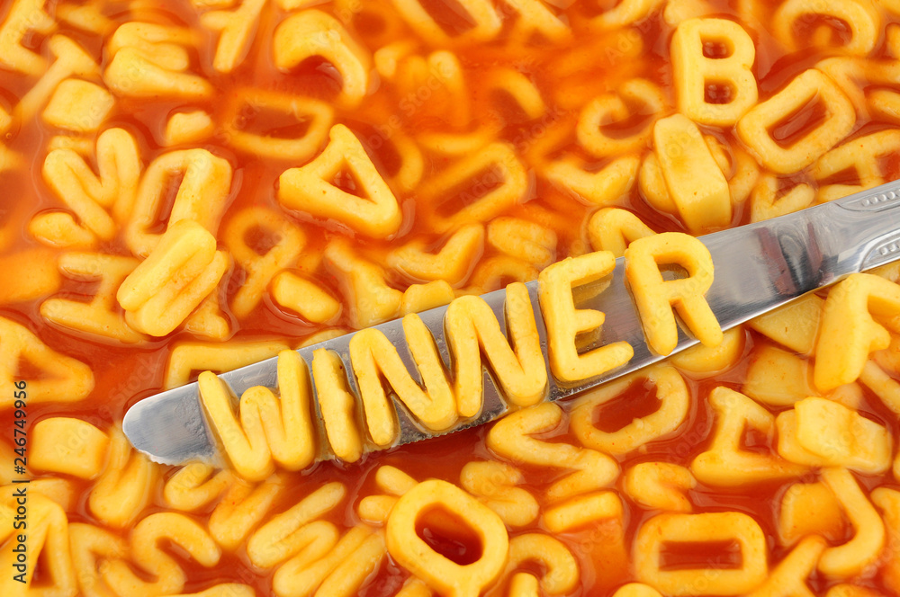 Foto de Stock Alphabet spaghetti spelling winner with random letters in ...