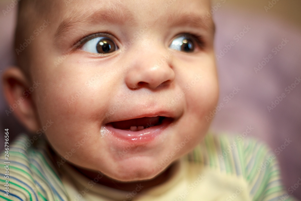 Emotions baby close up, surprise, delight, big bulging eyes;Portrait of ...