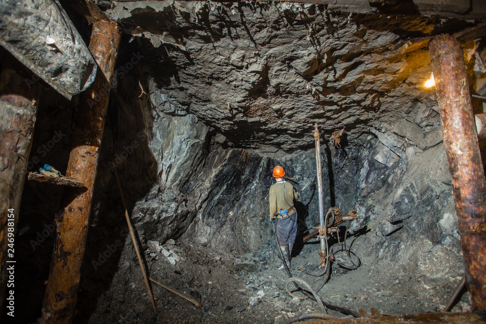 Underground gold ore emerald mine shaft tunnel gallery passage with drilling miner Stock Photo ...