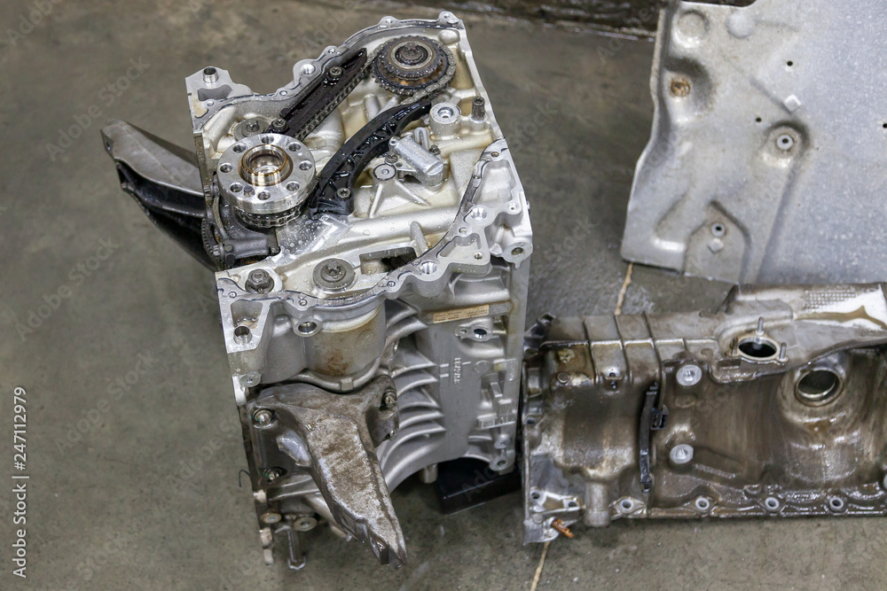 Part of the engine removed from the used car for the repair of silver ...