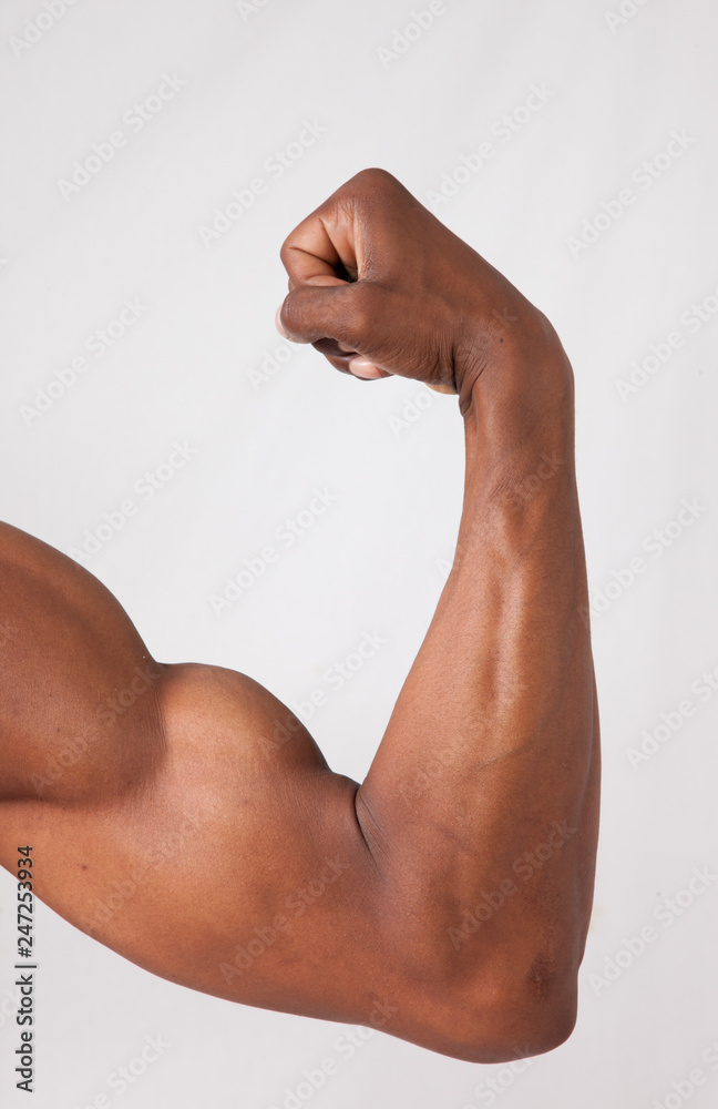 Strong Black man flexing muscles Stock Photo | Adobe Stock