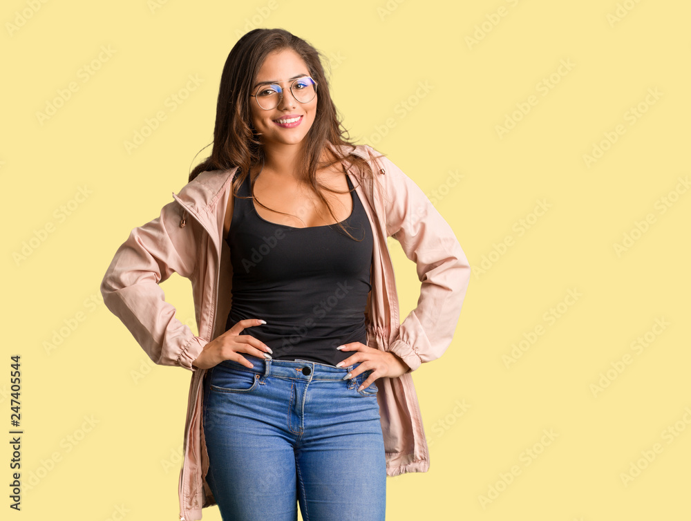 Full body young curvy woman with hands on hips Stock Photo | Adobe Stock