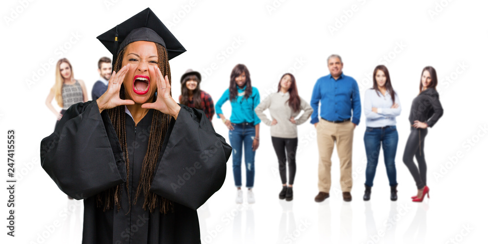 Young graduated black woman wearing braids screaming angry, expression ...