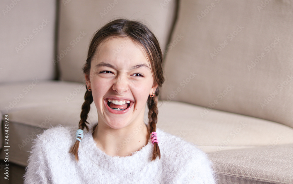 Photo Stock Portrait of beautiful happy laughing preteen girl with two ...