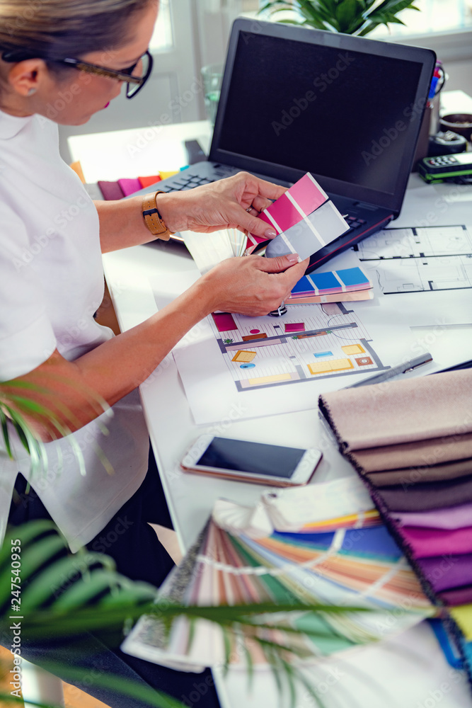 Architect choosing colors in color swatch sample Stock Photo | Adobe Stock