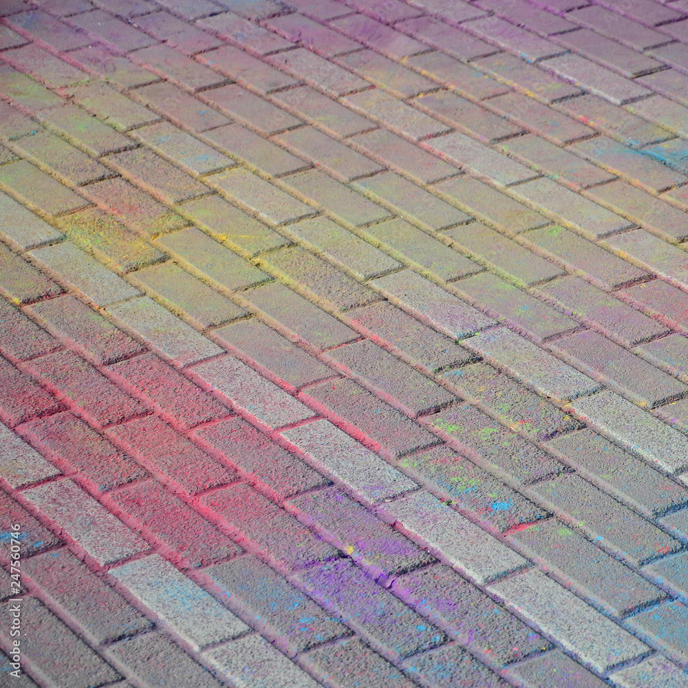 Multi colored paving slabs, powder coated with dry colors at the Holi ...