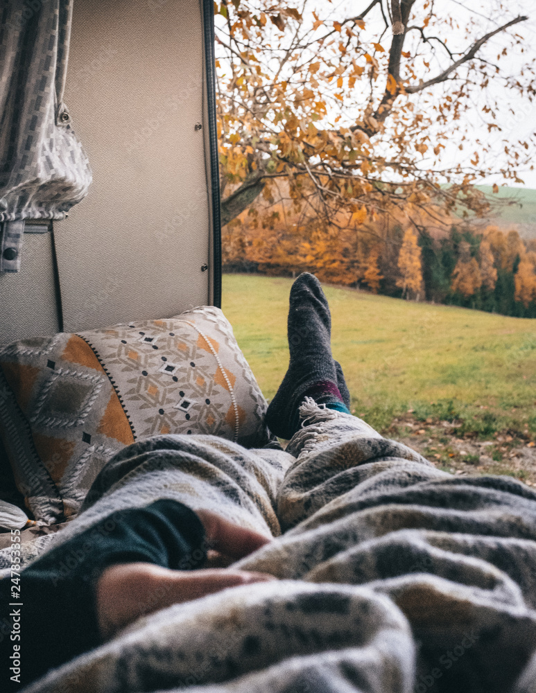 Person wrapped in blanket Stock Photo | Adobe Stock