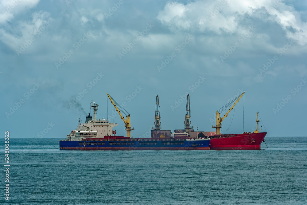 Loading big mother sea bulk carrier ship with Bauxite aluminium ore ...