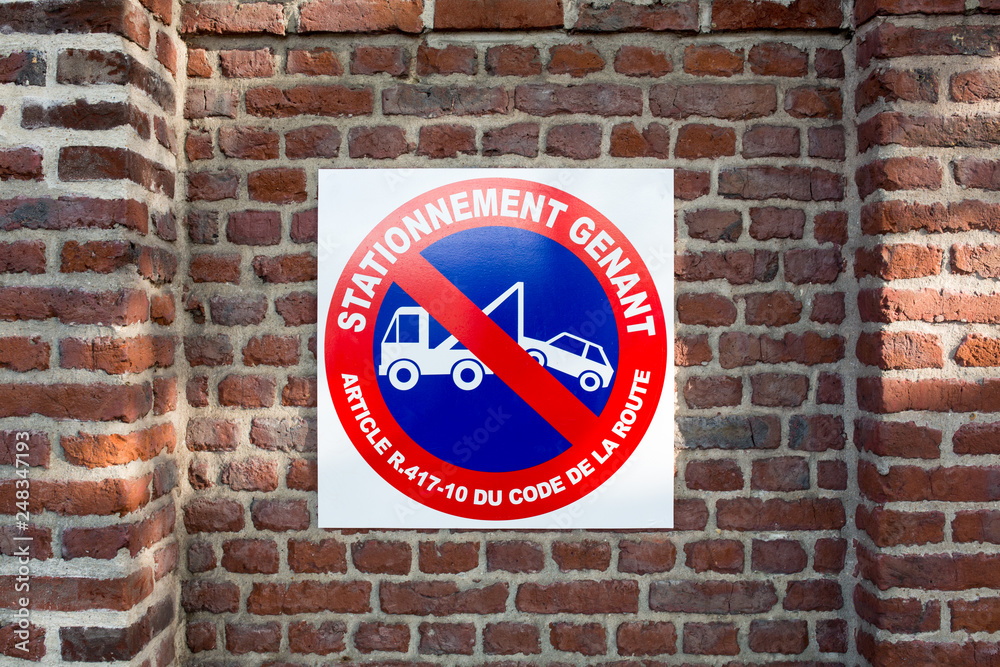Circular French sign: "No Parking Allowed" / "Stationnement Genant" on ...