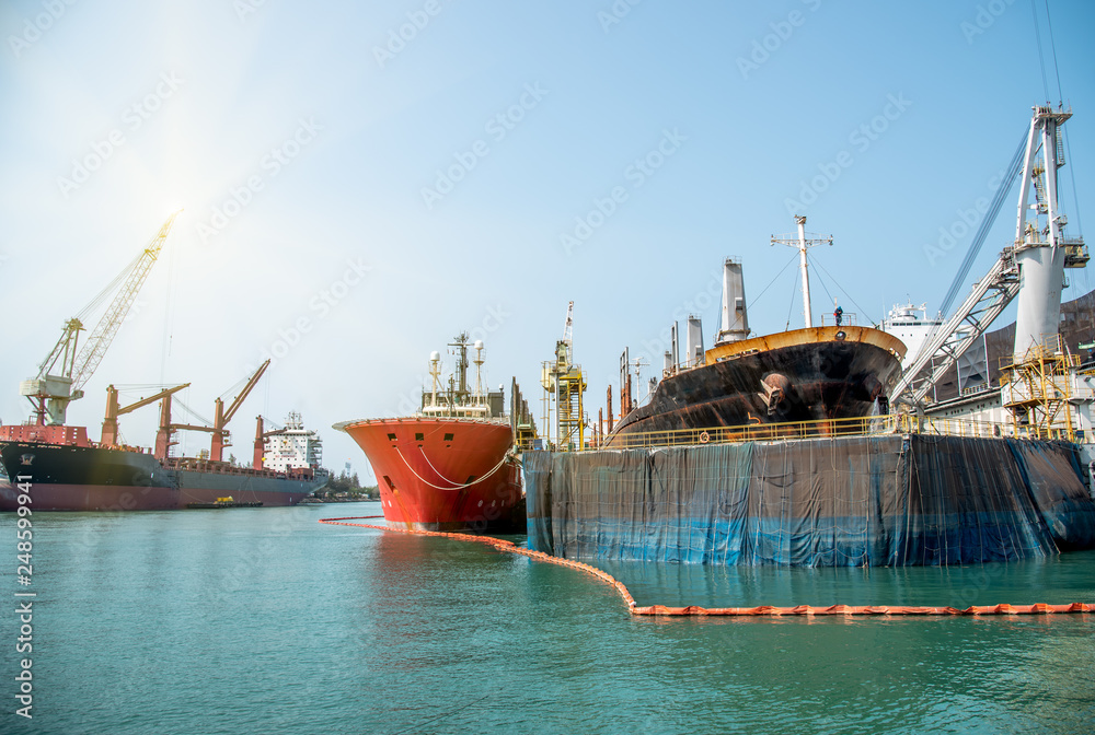 ships in dock yard under repairing with secured water pollution by ...