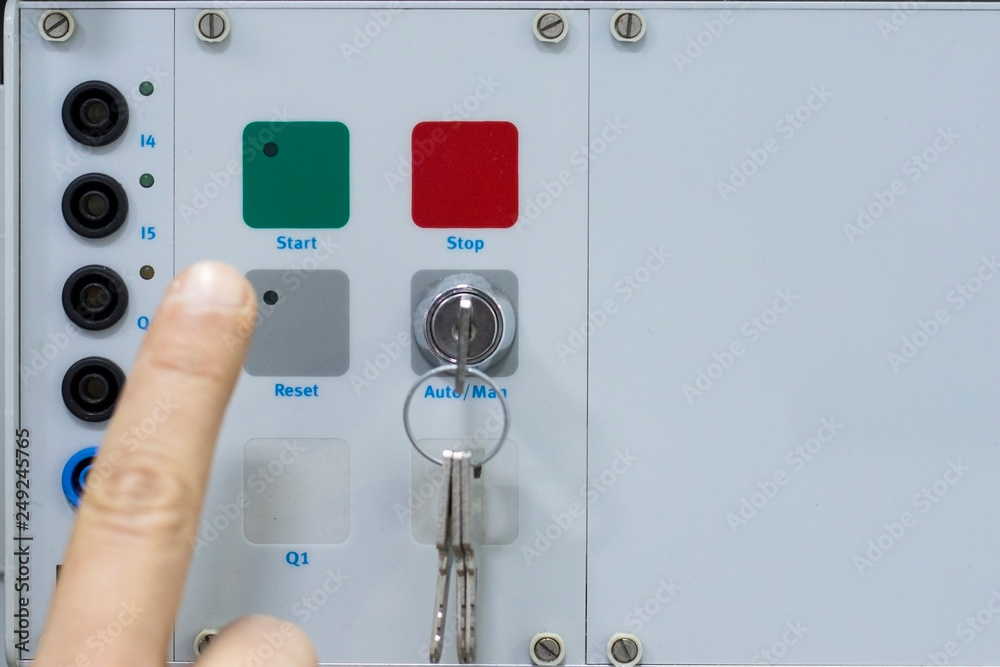 Male Hand Pushing Stop and Reset Buttons of Control Panel for ...