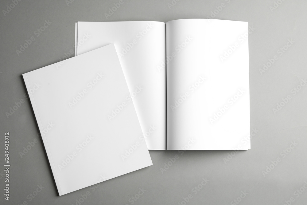Open and closed blank brochures on grey background, top view. Mock up ...