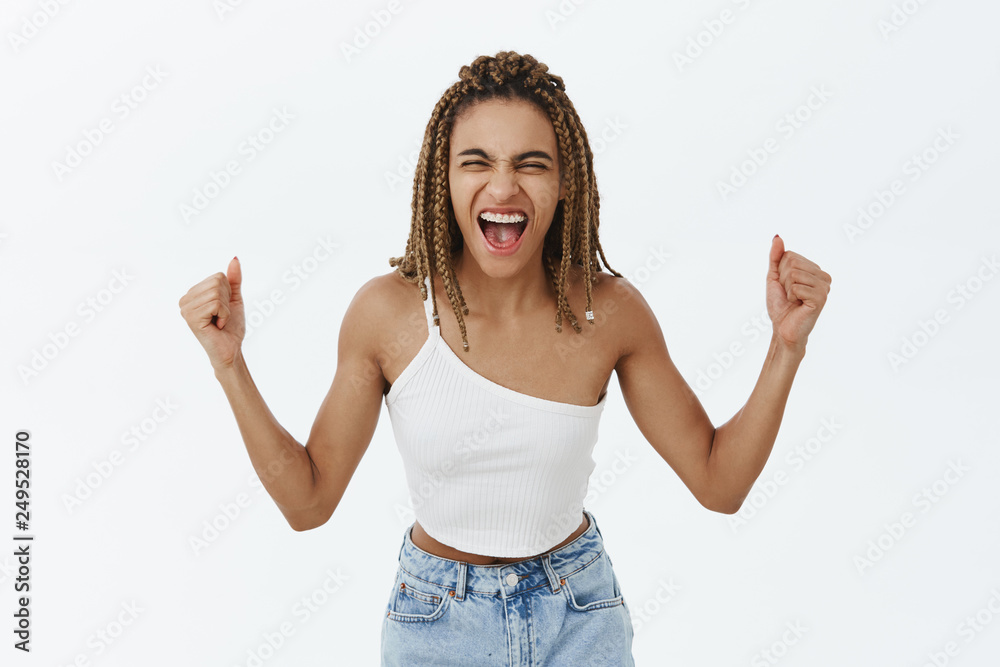 Faithful good-looking emotive and charismatic dark-skinned female fan ...