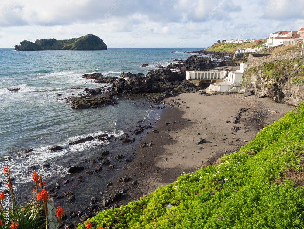 Sand beach of town Vila Franca do Campo with its famous volcanic islet ...