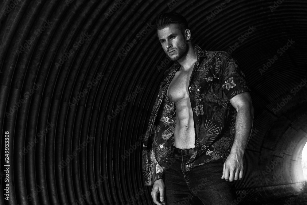 Muscular Young Man With Beard On Dark Tunnel Urban Background Fashion