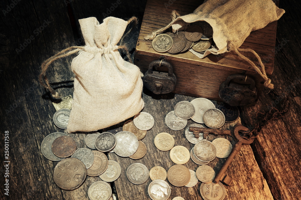 Pouch with old money and coins.Treasure chest.Padlocks and keys.Travel ...