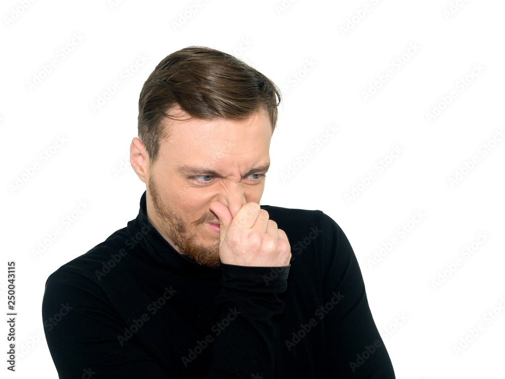 Young man with disgust on his face punched nose, something stinks, very bad smell. Isolated on ...
