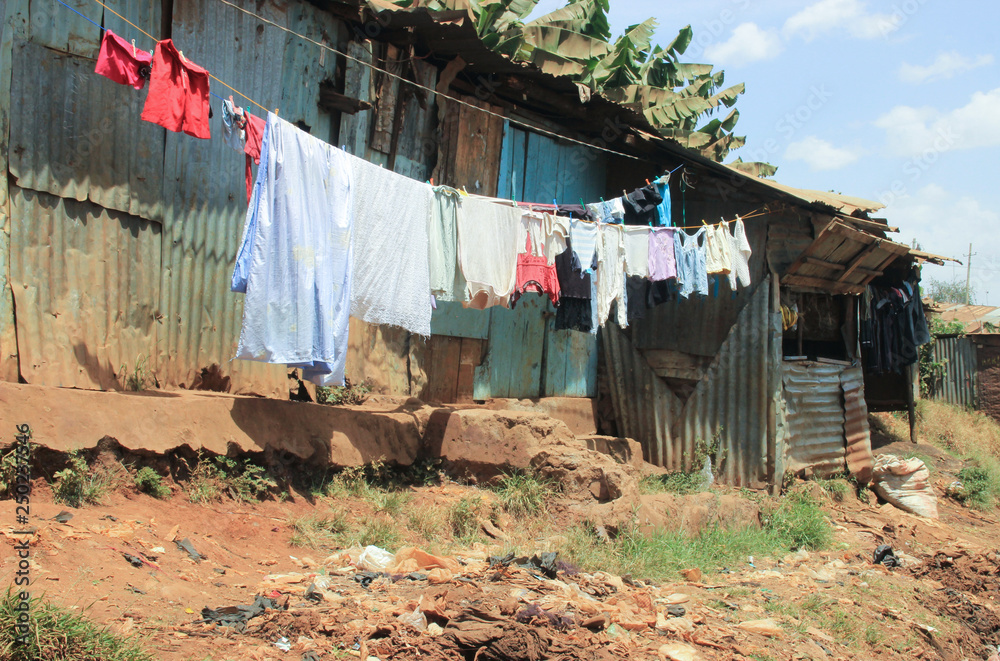 clothes are drying on ropes in the slums of Nairobi - one of the ...
