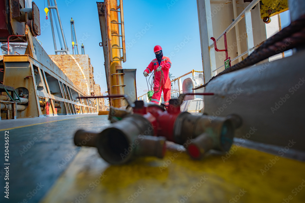 fireman prepare hose fire rubber standing by in the job site, ready to ...