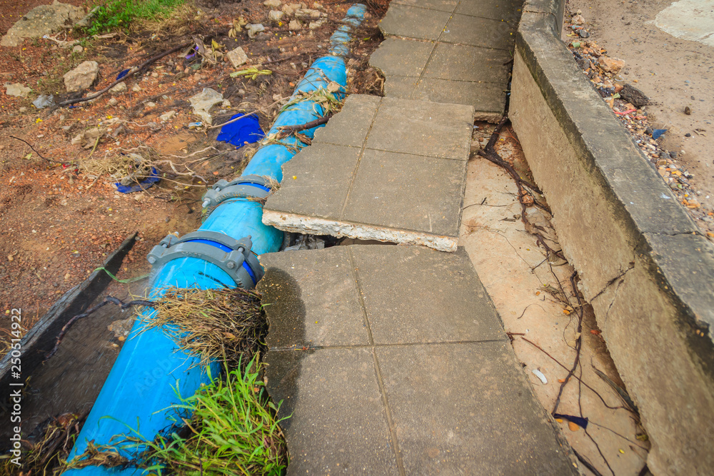 Flood water flow causing landslides and municipal water pipes made of ...