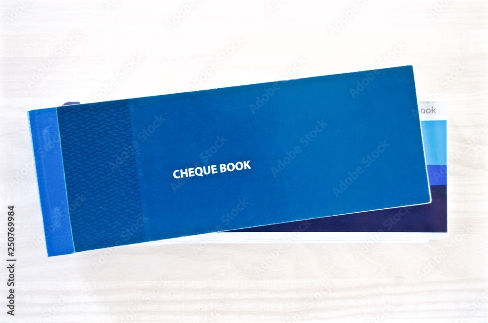 Cheque book, "Wooden background" Stock Photo | Adobe Stock