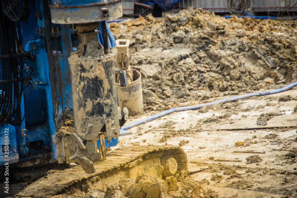 Hydraulic drilling machine is boring holes in the construction site for ...