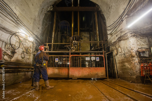 Underground gold ore mine shaft tunnel lifting cage and miner Stock ...