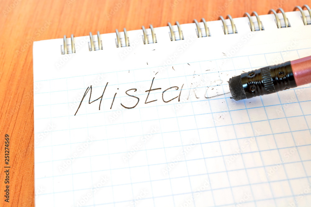 Rubber eraser on the tip of the pencil erases letter of word mistake ...