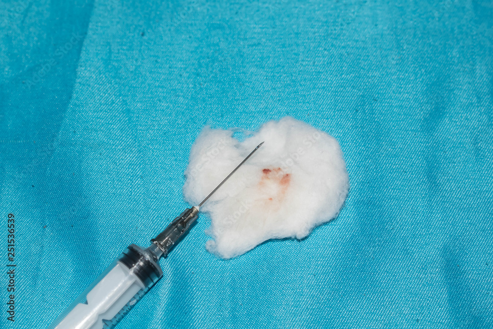 prick intramuscular injection with an antibiotic syringe into the ...