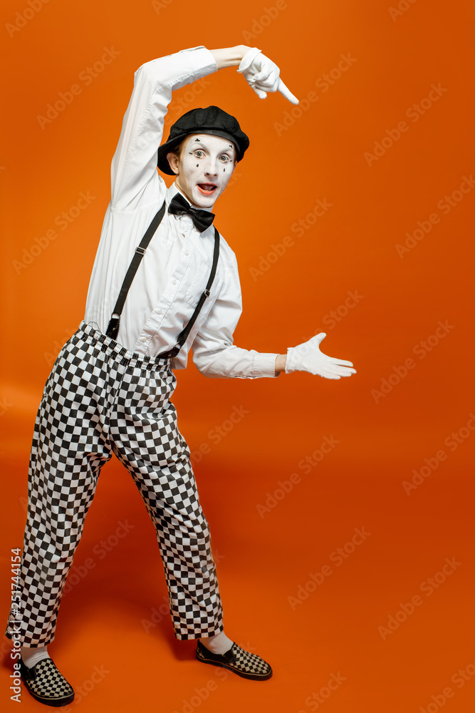 Emotional pantomime with white facial makeup showing empty space on the ...