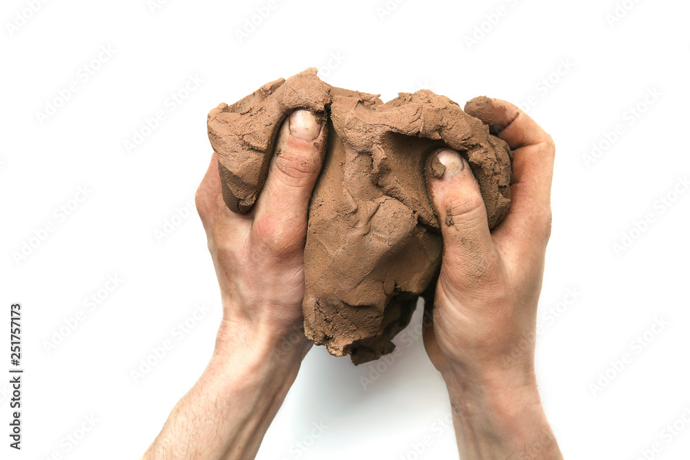 Natural clay piece in hands isolated on white background. Wet clay ...