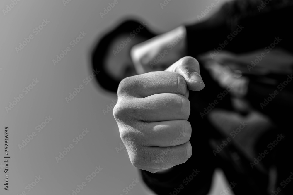 Unidentifiable teenage boy attacking with hes bare hands, focus on the ...