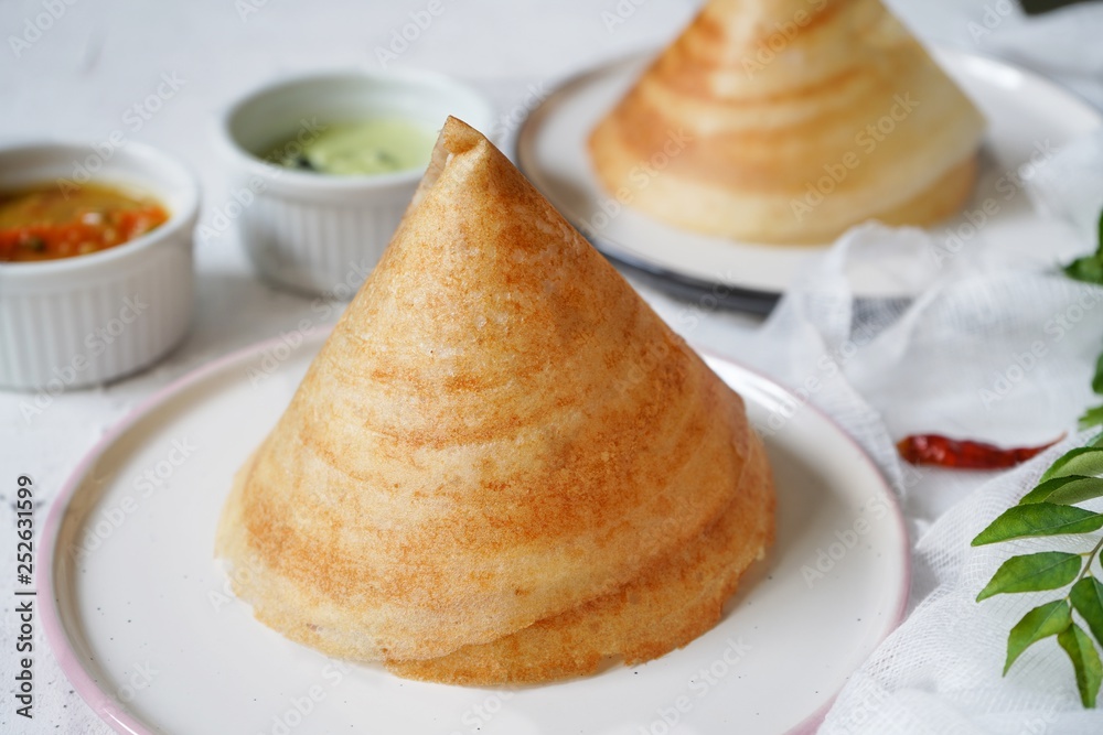 South Indian breakfast cone shaped dosa Idli sambar and chtney ...