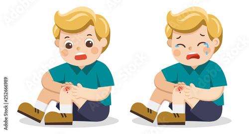 A Boy holding painful wounded leg knee scratch with blood drips. Child ...