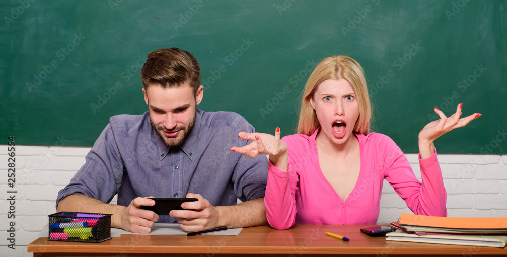 Surprising answer. Studying hard. How is it possible. Guy and girl sit ...