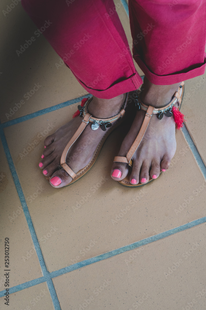 British Indian woman - feet in ethnic footwear with cymbals and tassel ...