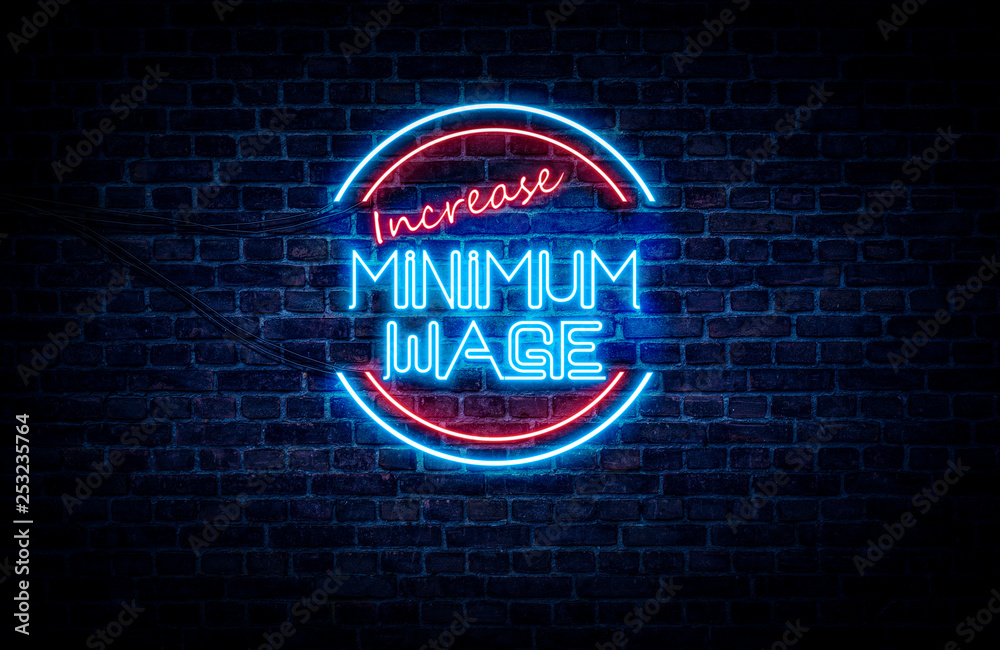 A neon sign in blue and red light on a brick wall background that reads ...
