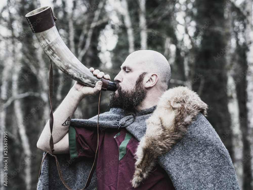 Viking using battle horn Stock Photo | Adobe Stock