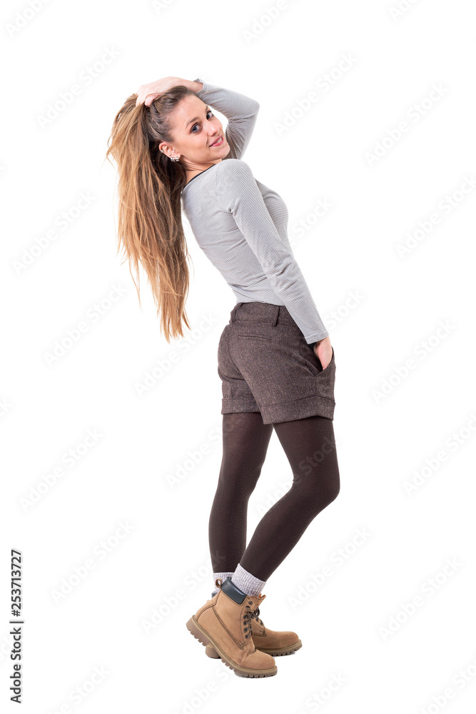 Side view of cute beautiful long hair hipster blonde girl bending ...