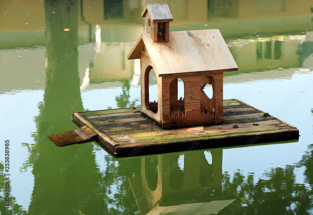 handcrafted floating wooden birdhouse for ducks Stock Photo | Adobe Stock