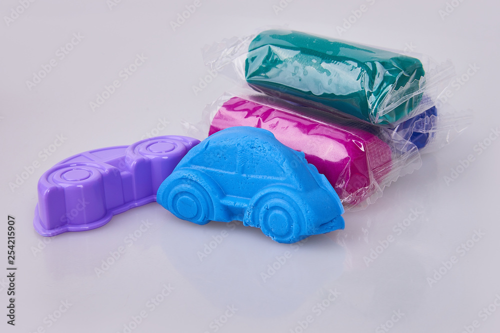 A car formed from blue play dough (plasticine). Modeling. Play dough in ...