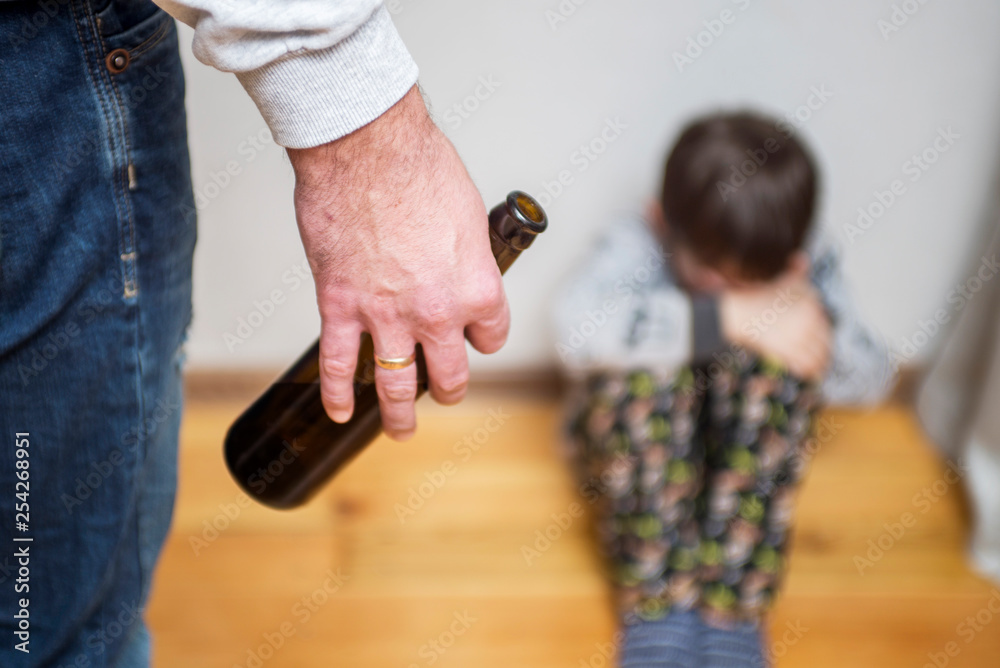 Photo Stock Drunk parent and little scared son. Violence against ...