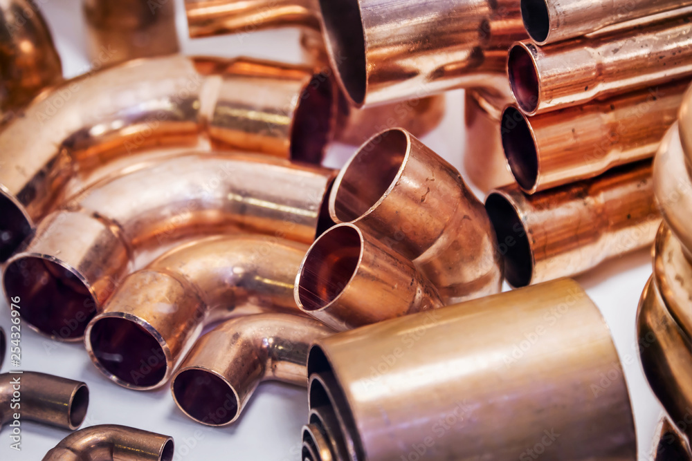 copper pipes of different diameter and sizes and adapters Stock Photo ...